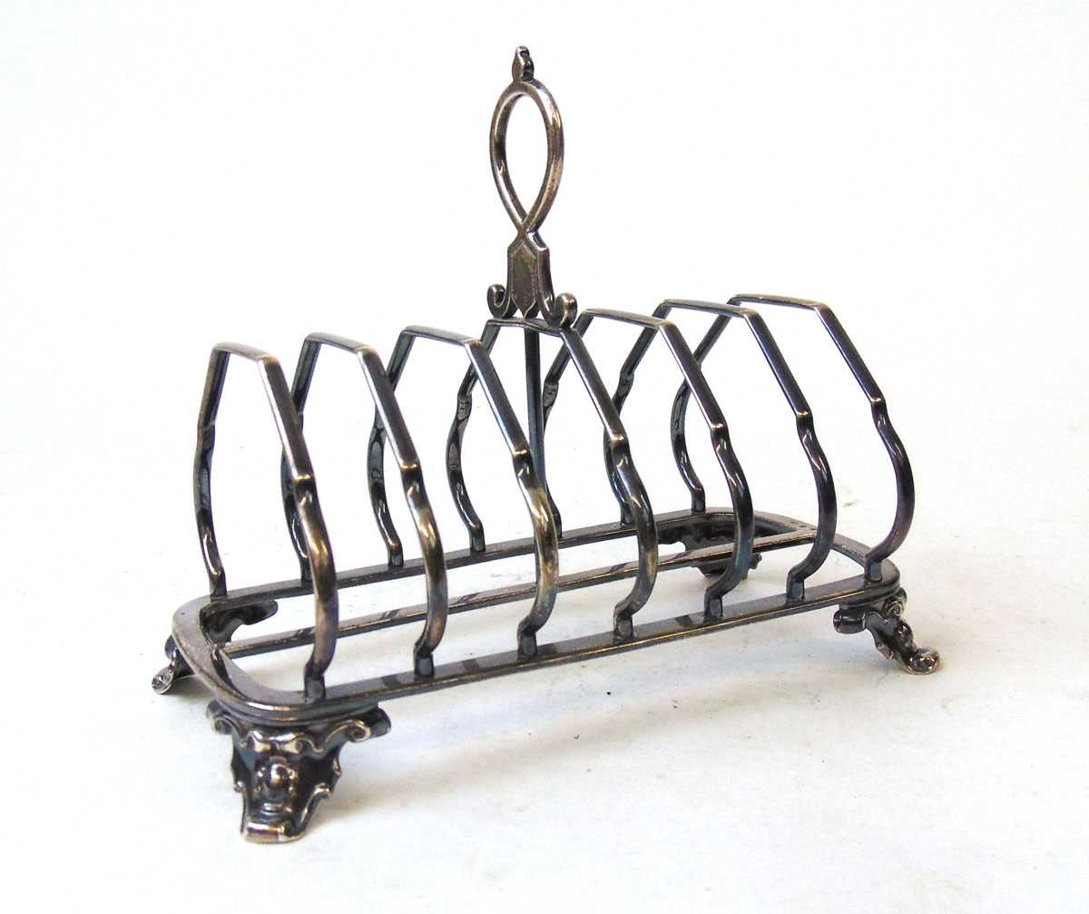 Lot 408 - A Victorian silver toast rack. Hallmarked