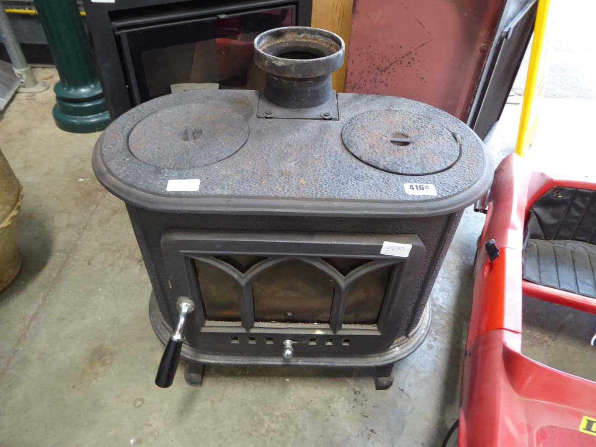 Lot 4164 - Cast iron wood burning stove with hot